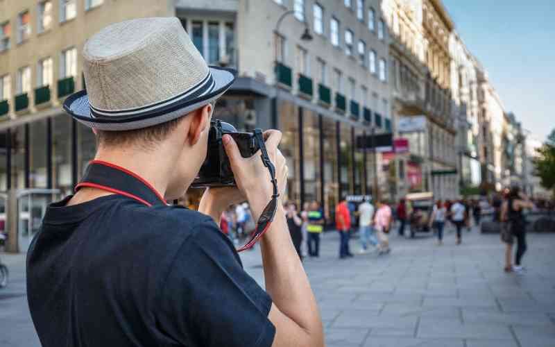 How are street photographers regulated by law?